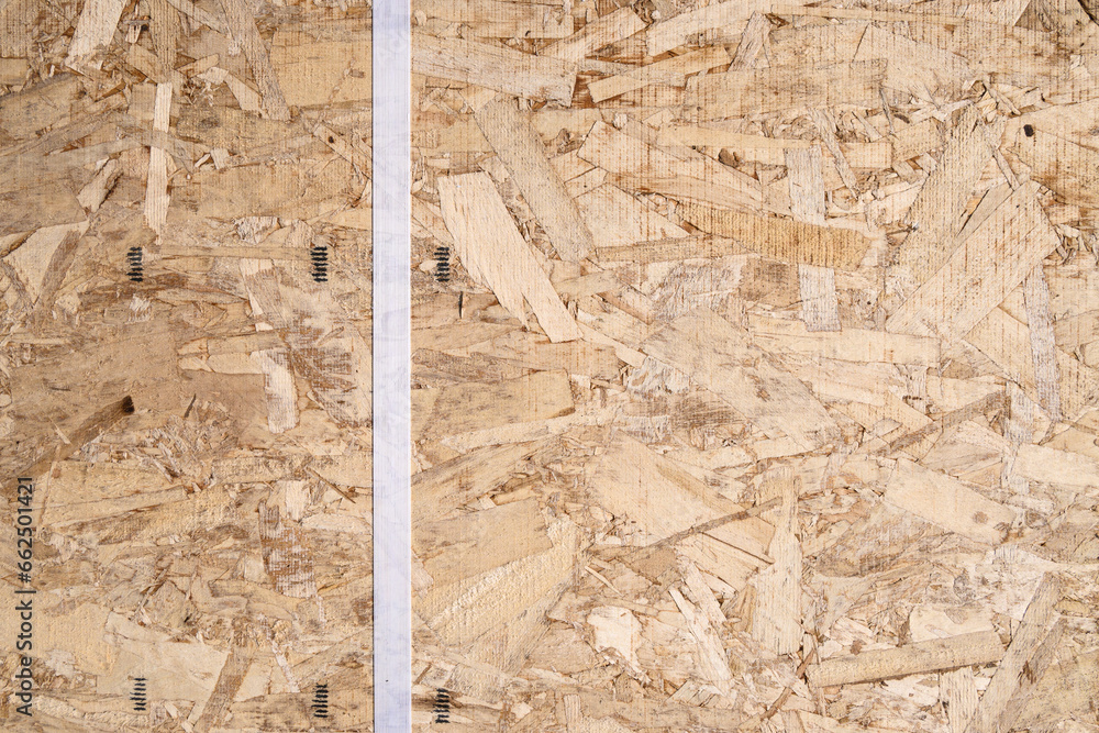 Closeup of a section of new Oriented Strand Board (OSB) engineered wood ...