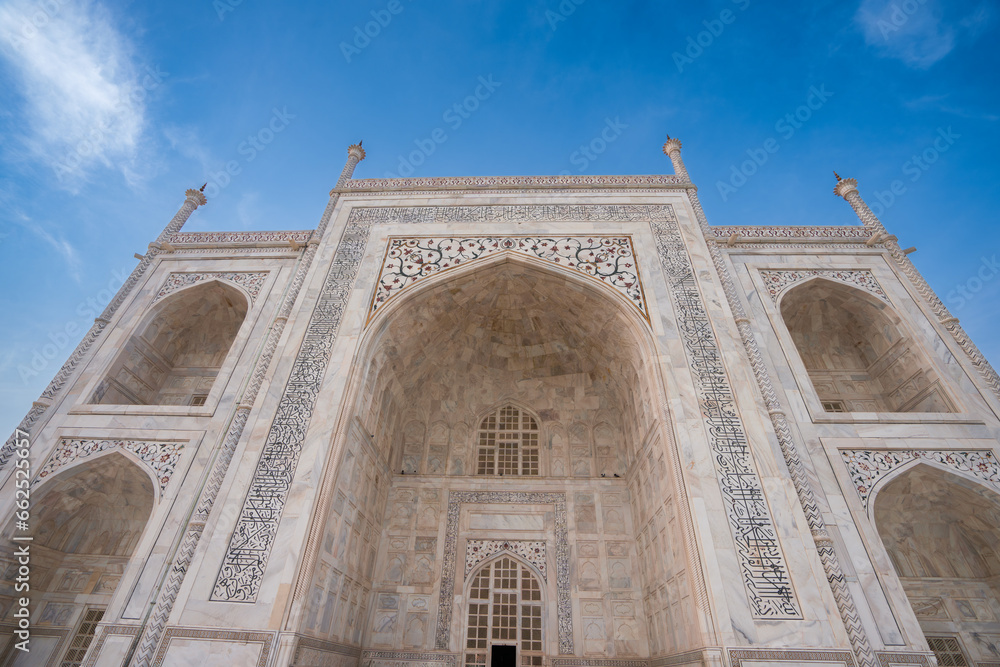 Side view of the Taj Mahal's white domes and white towers at sunset ...