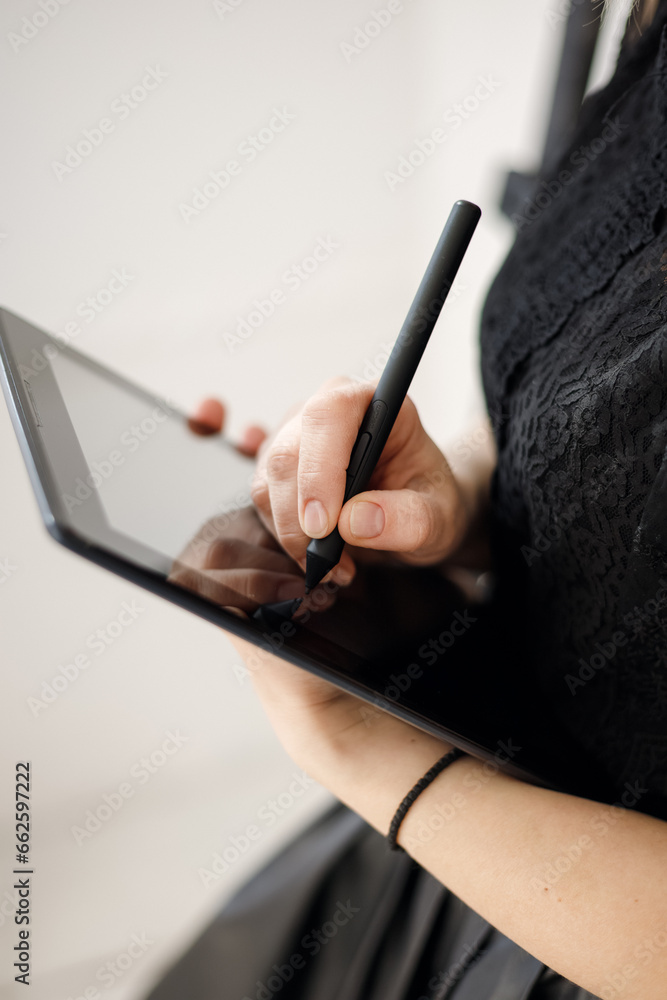 Graphic tablet with stylus, graphic designer, working using pen tablet ...