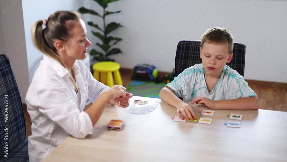 ABA Therapist Leads Therapy Session with Autistic Boy Using Color Cards ...