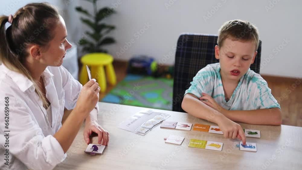 ABA Therapist Leads Therapy Session with Autistic Boy Using Color Cards ...