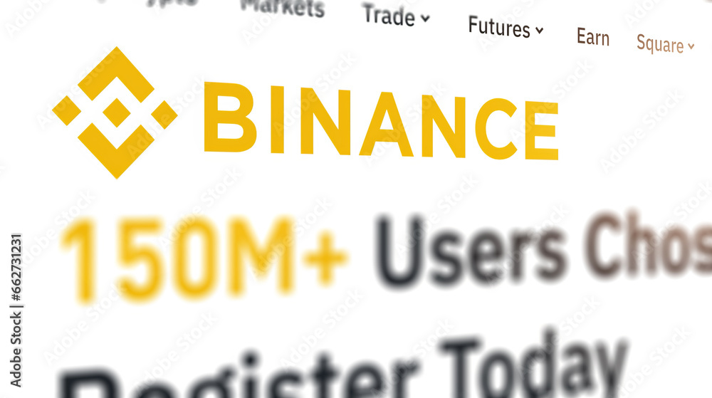Binance website on screen with perspective with company logo ...