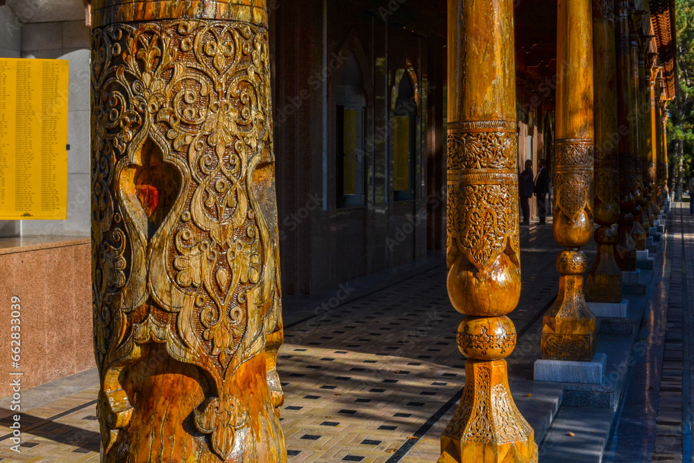Uzbek traditional carved wooden columns of WWII Memorial in Tashkent ...