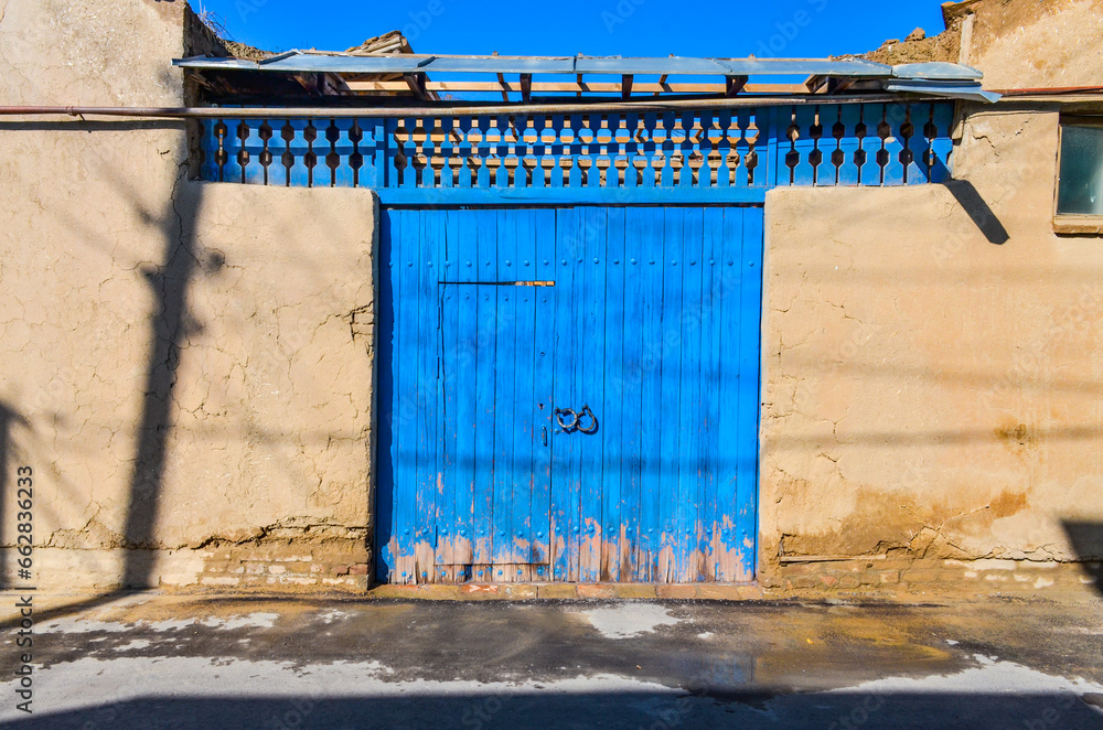 blue house gates in traditional Uzbek Hazrati Imam mahalla (Olmazor ...