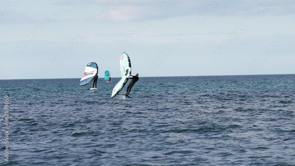 Modern water sport. Hydrofoil ride on the ocean using the wing and the ...