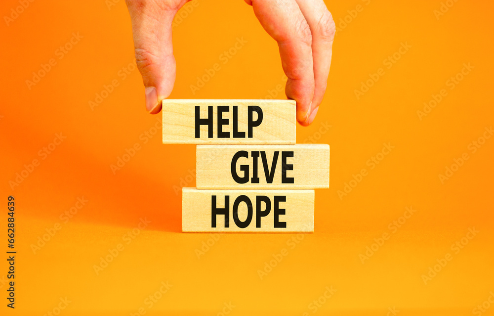 Help give hope symbol. Concept word Help give hope on beautiful wooden ...