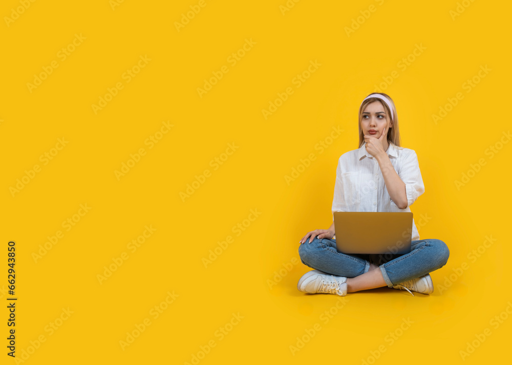 Poster Blonde girl pondering over a problem, full body view caucasian ...