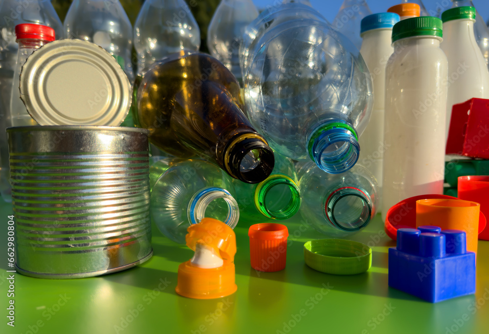 Plastic Recycling. Tin can and plastic Bottle Caps for Recycling. Steel ...