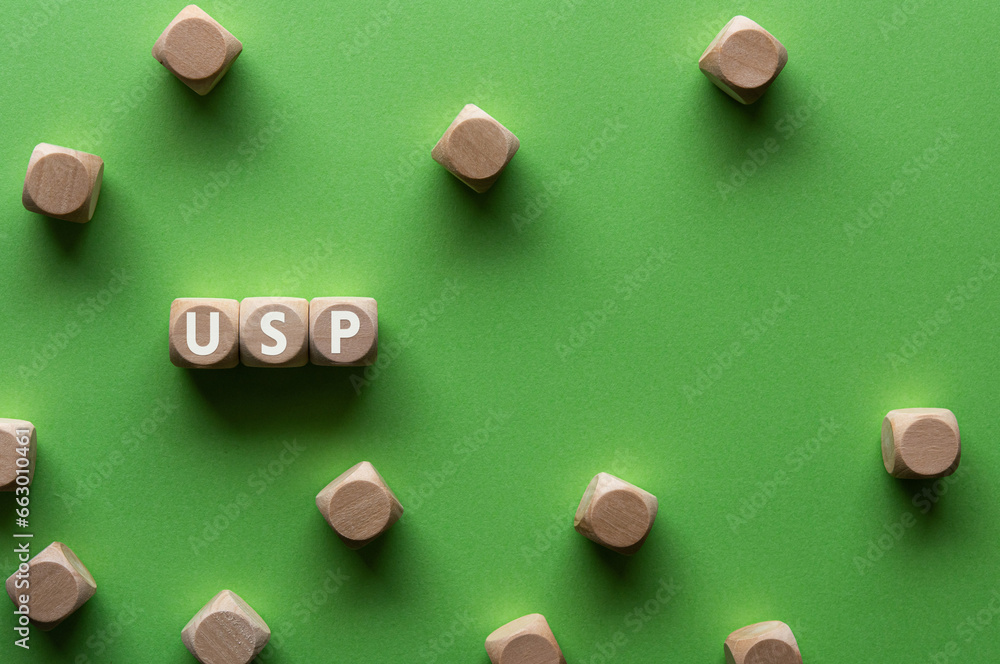 There is wood cube with the word USP. It is an abbreviation for Unique ...