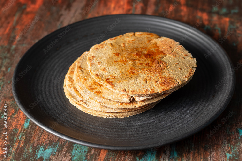 healthy food "Bajra Roti" or "Bakra Bhakri" is ready to eat. Stock ...