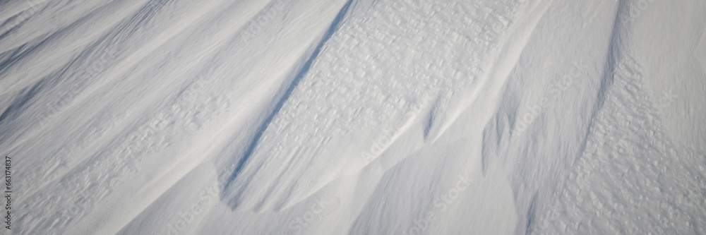 Snow texture. Wind sculpted patterns on snow surface. Wind in the ...