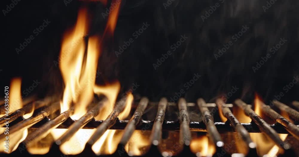 Grill in the kitchen of the restaurant or outdoors nature, the flame ...