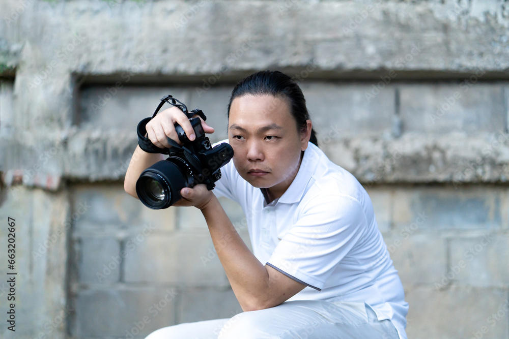 Professional Asian Chinese - Thai Camera man posture and focus in ...