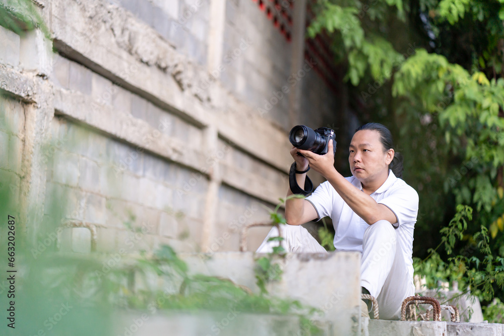 Professional Asian Chinese - Thai Camera man posture and focus in ...