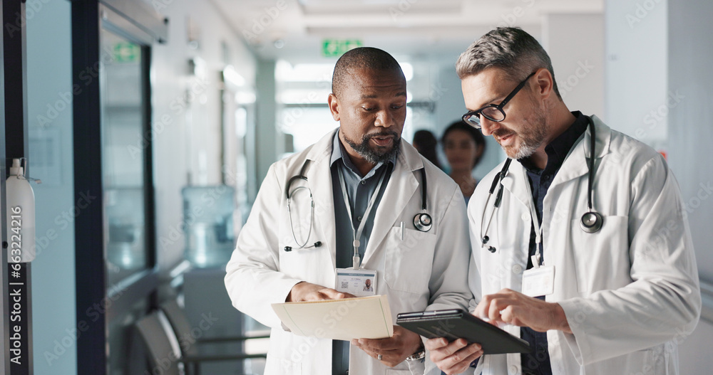 Doctors, teamwork and advice with documents, hospital folder and ...