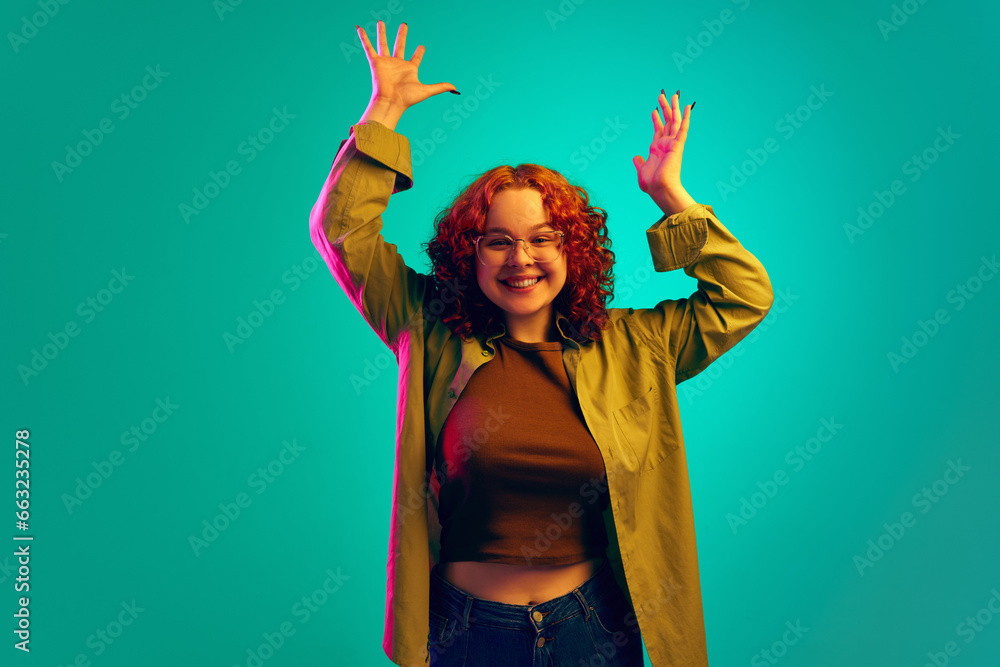 Teen girl in casual clothes standing with emotional face, expressing ...