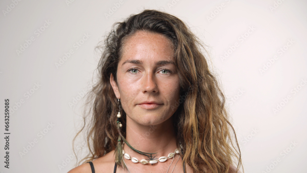 Beautiful person look at camera close up. Young adult woman face ...