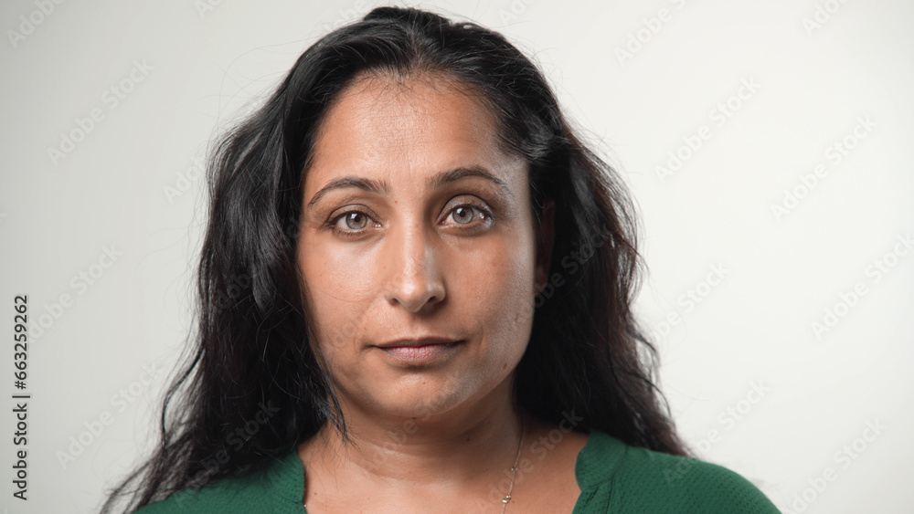 Beautiful person look at camera close up. Young adult woman face ...