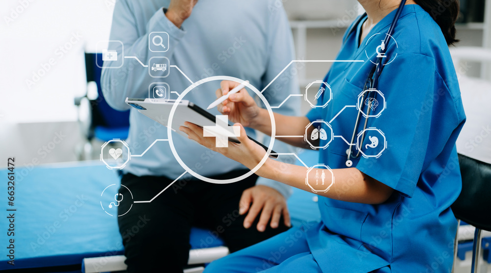 Friendly Female Head Nurse Making Rounds does Checkup on Patient ...