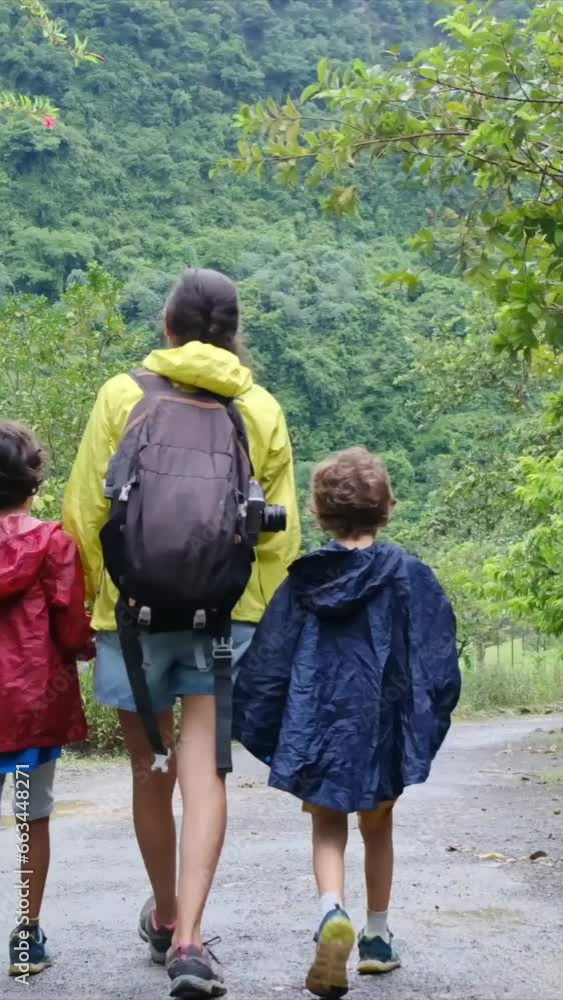 Embark with a spirited mother and her backpack-clad children, donning ...