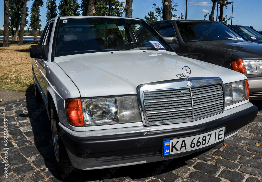 Front side view of white classic german car Mercedes-Benz W201 190E S ...