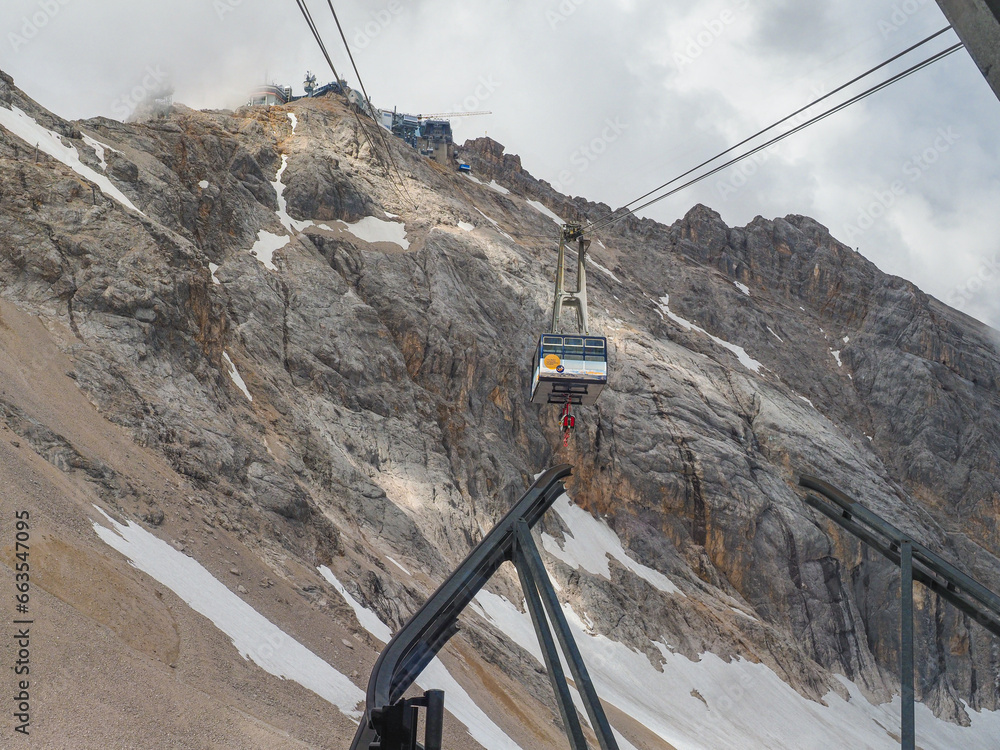 Tramway cabin in the background of Alpine mountains. Zugspitze Glacier ...