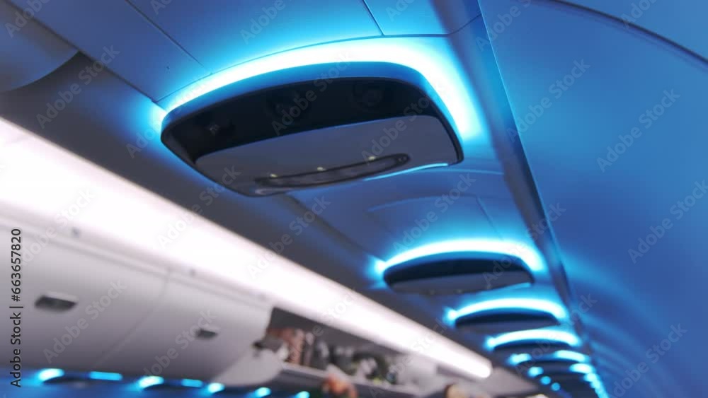 Onboard a flight with people sitting on the aircraft. Close up shot ...