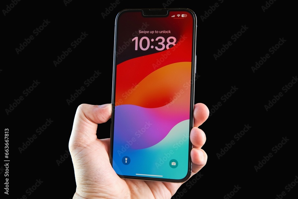 Poland Europe 11.09.2023. Man hand holding iPhone 13 pro max with IOS ...