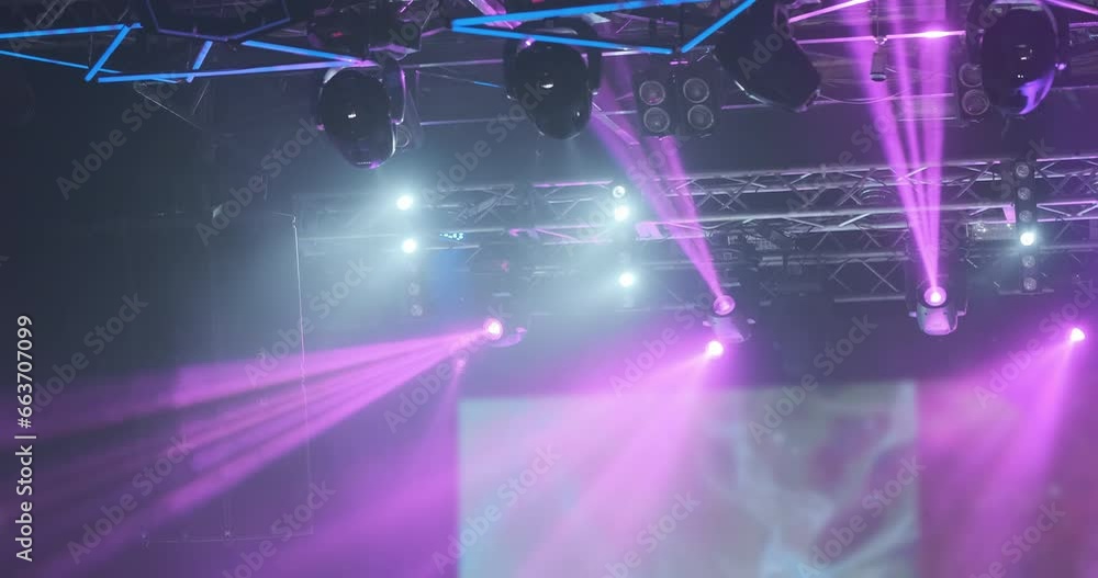 Pink rays motion of spotlights light in nightclub. Show illuminated ...