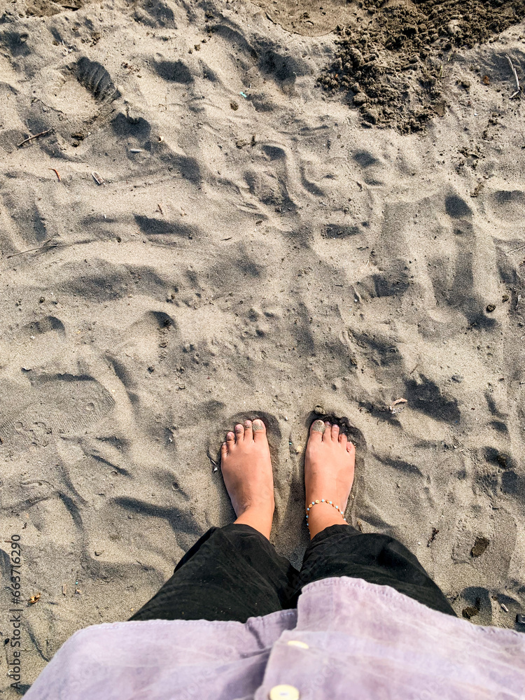 barefoot step on the sand, grounding concept. Stock Photo | Adobe Stock