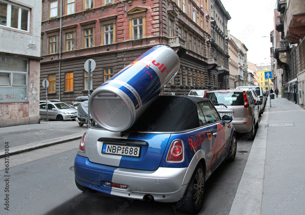 Red Bull promotion car with logo. Giant Red Bull energy drink can on ...