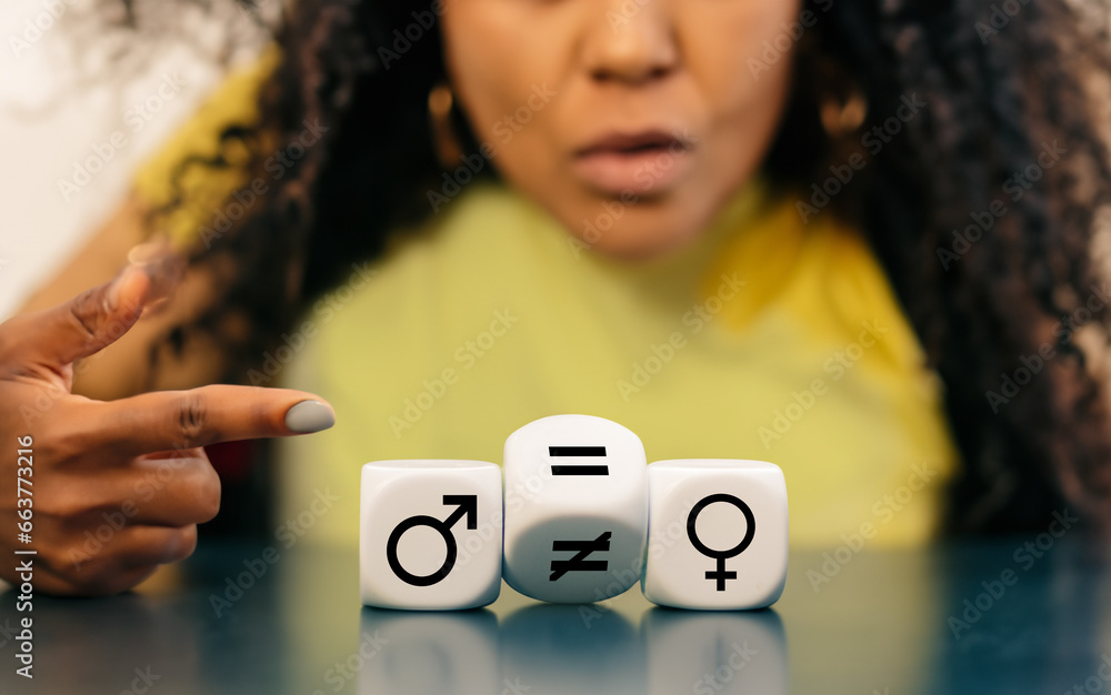 Symbol for gender equality. Women pointing to dice with the unequal and ...
