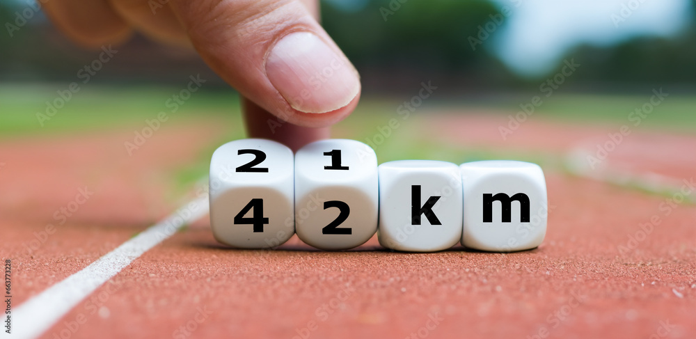 Dice form the expression '21 km' and '42 km'. Symbol for the distance ...