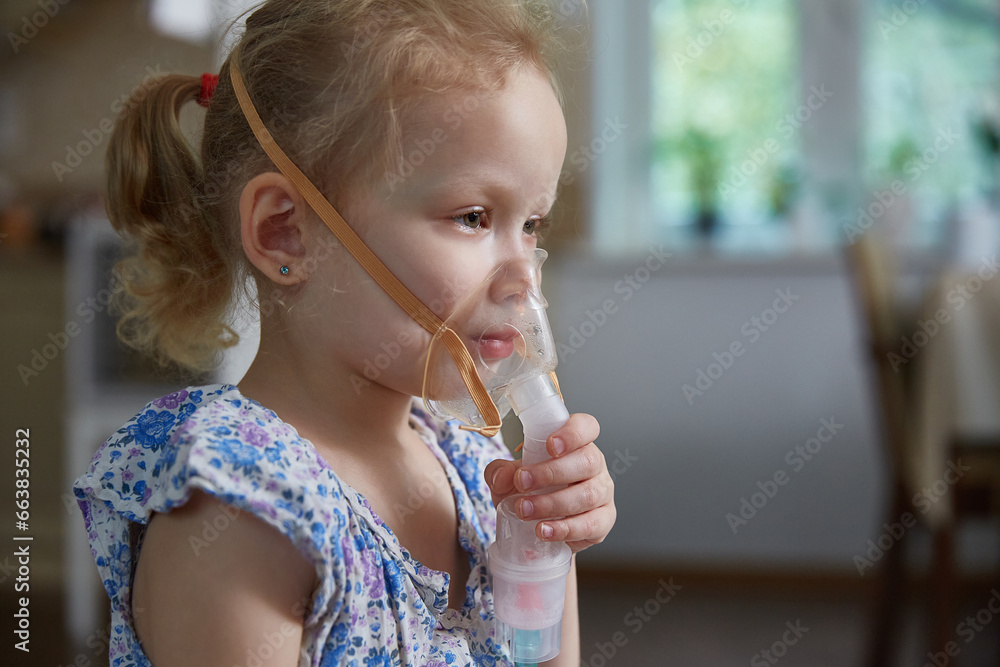 Sick little girl making inhalation with nebulizer to reduce coughing ...