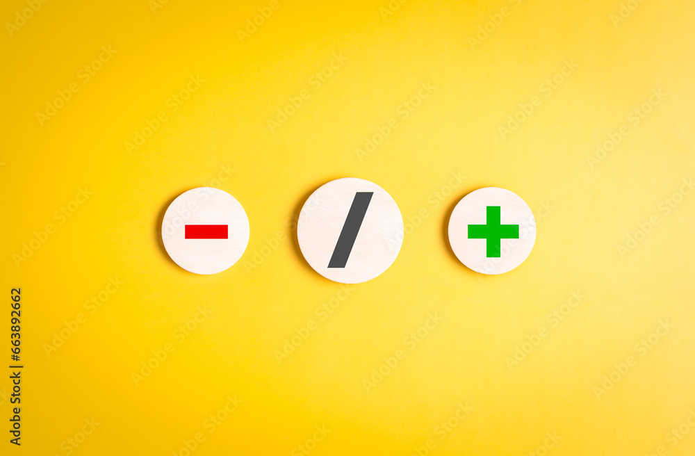Plus and minus signs symbols on wooden circles with yellow background ...