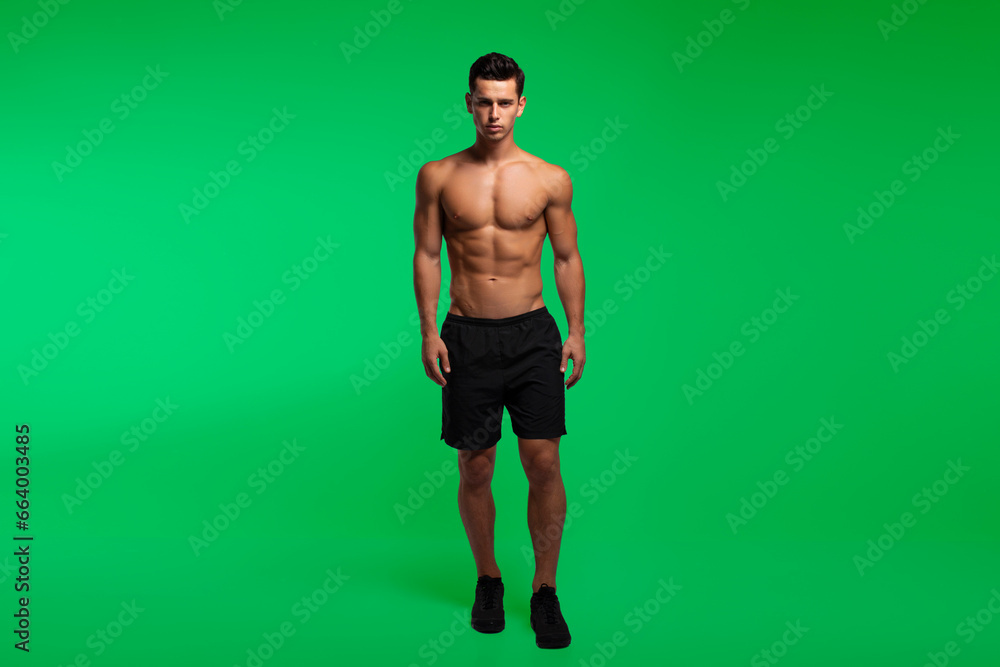 Full length image of a man with an athletic and fit body, posing in the ...