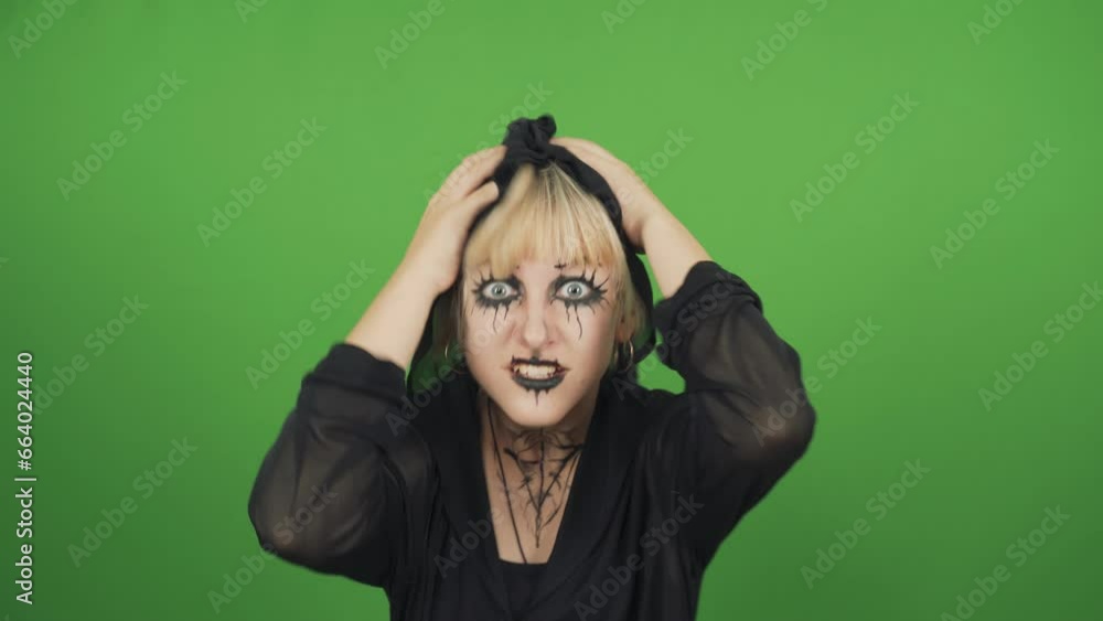 Vidéo Stock Portrait of a goth girl in black clothes and special makeup ...