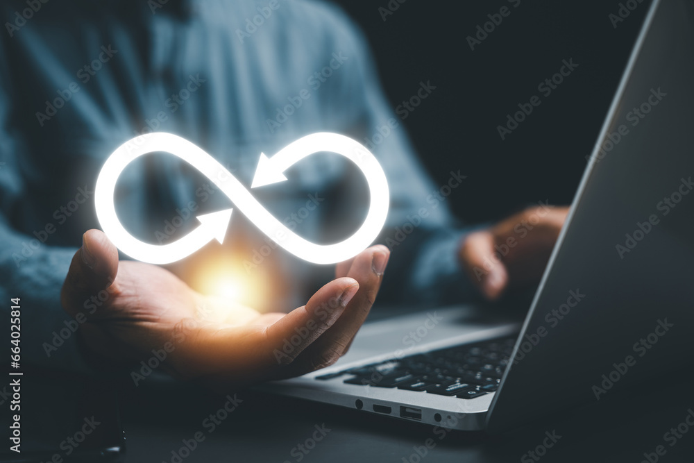 Businessman presents circular infinity symbol, signifying circular ...
