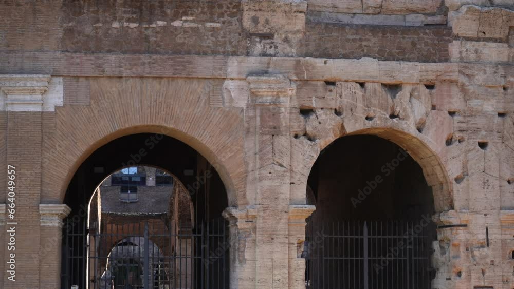 Restored facade of ancient of Roman Colosseum amphitheater on sunny day ...