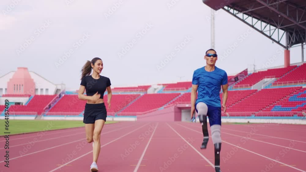 Asian athlete with prosthetic blades and trainer workout in stadium ...