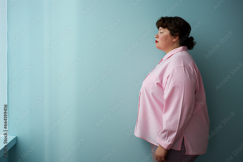 Beautiful overweight woman standing sad in front of pastel background ...