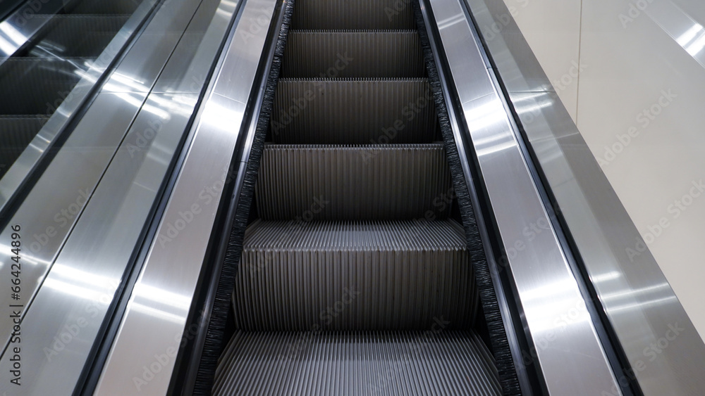 Escalator stairway steps technology for customer use moving up and down ...