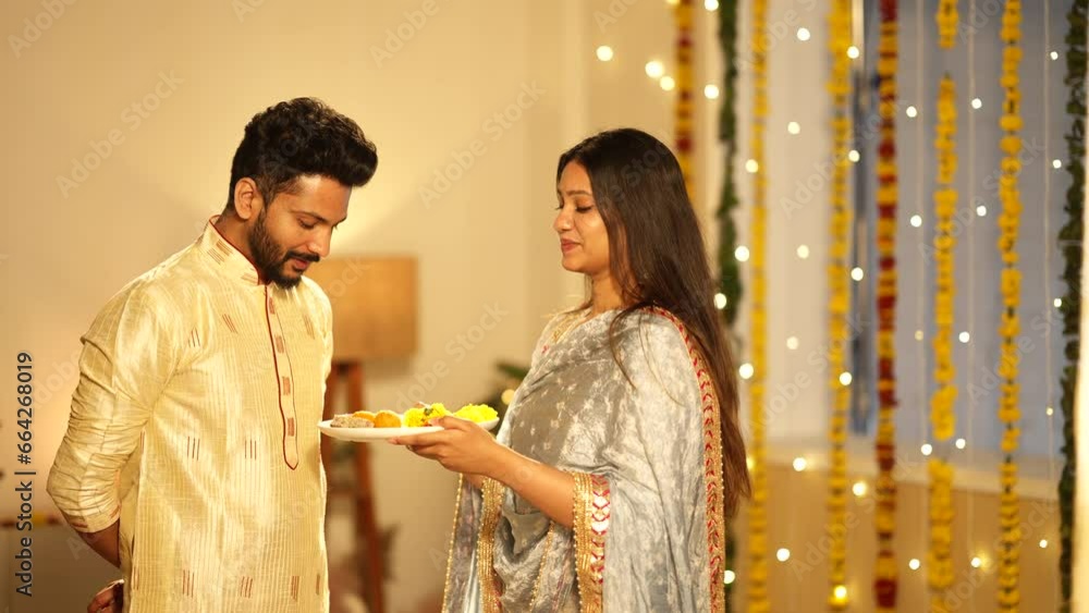 Indian Woman giving puja blessings to her husband from aarti thali ...