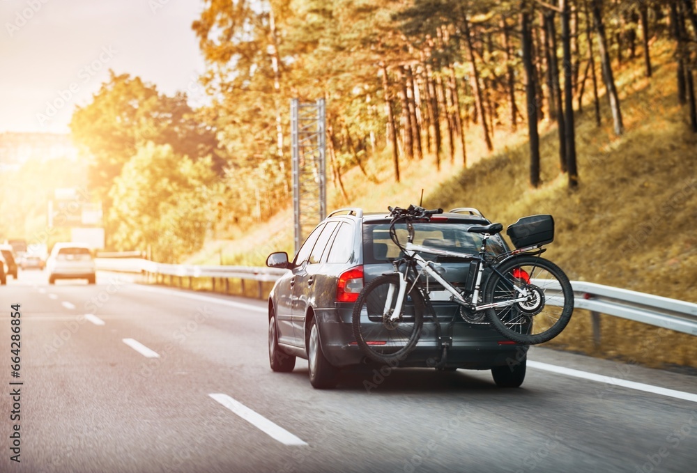 Trunk bicycle transporting. Back view car with mounted bike tail ...