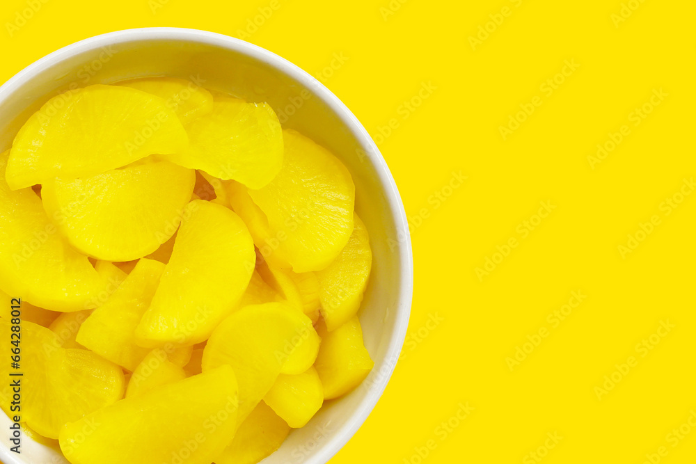 Sweet and tart slices of yellow pickled daikon, known as takuan in ...