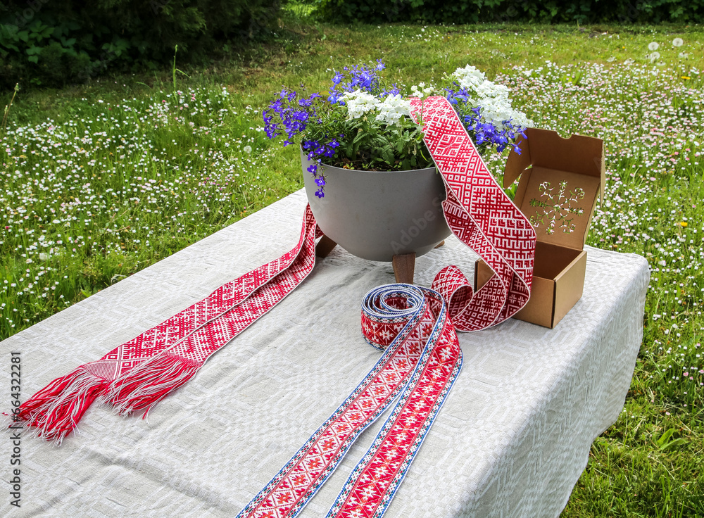 National symbols of Latvia is Lielvarde belt in traditional black and ...