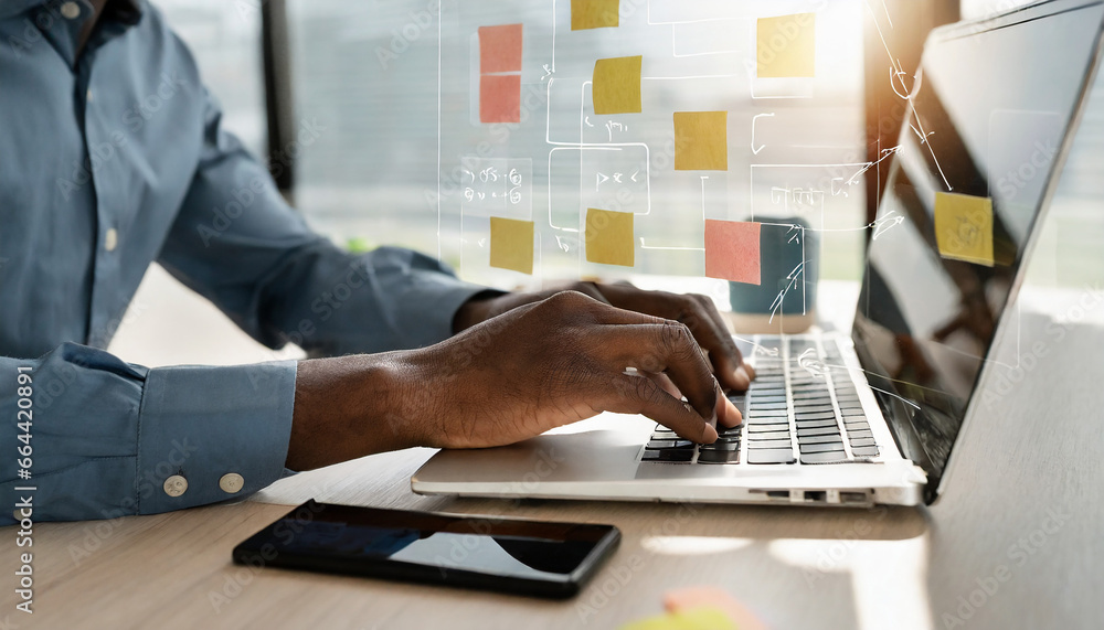 Business developer using Kanban board framework on laptop computer. Agile software development ...