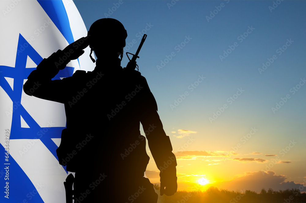 Silhouette of soldier with Israel flag against the sunset. Concept ...