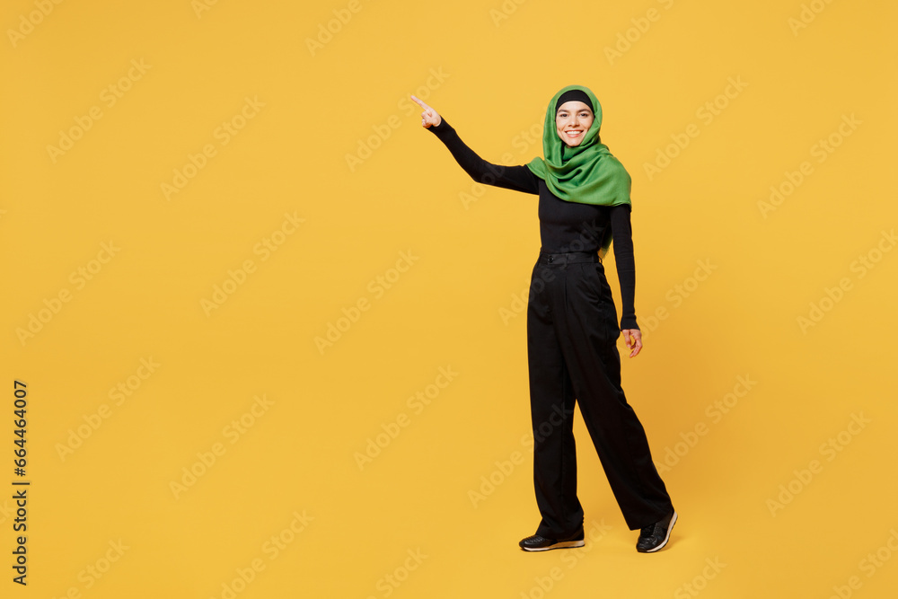 Full body side view young arabian asian muslim woman wearing green ...