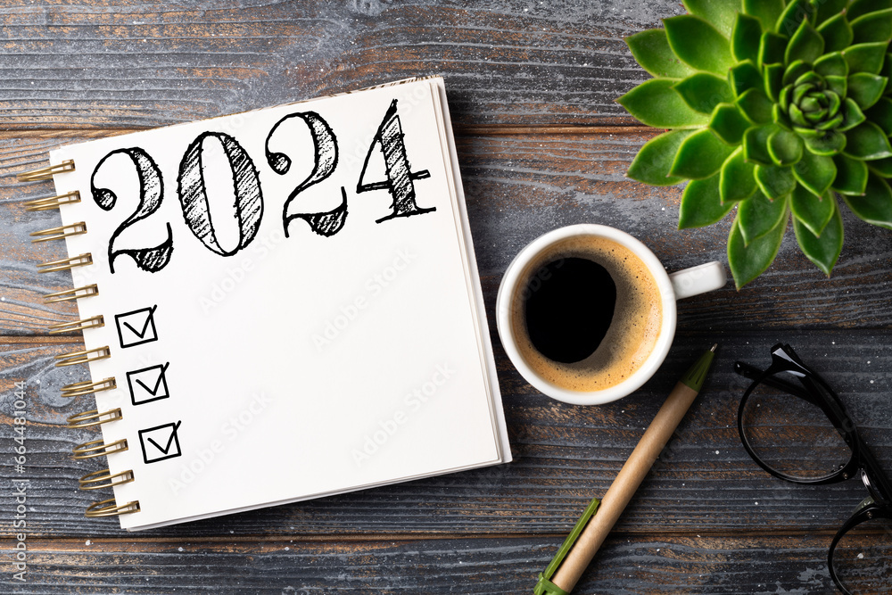 New year resolutions 2024 on desk. 2024 resolutions list with notebook ...